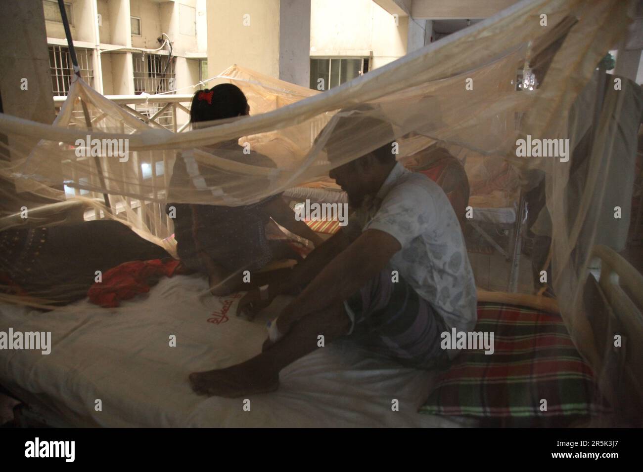 Dengue fever patients lying on the floor and on the bed outside the ...