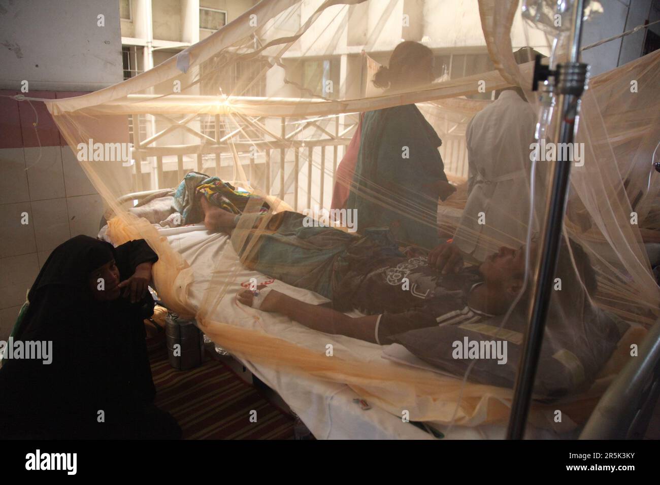 Dengue fever patients lying on the floor and on the bed outside the ...