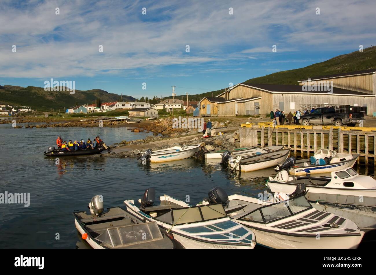 Zodiac with tourists accosting a wharf of Nain, Labrador, Canada Stock ...