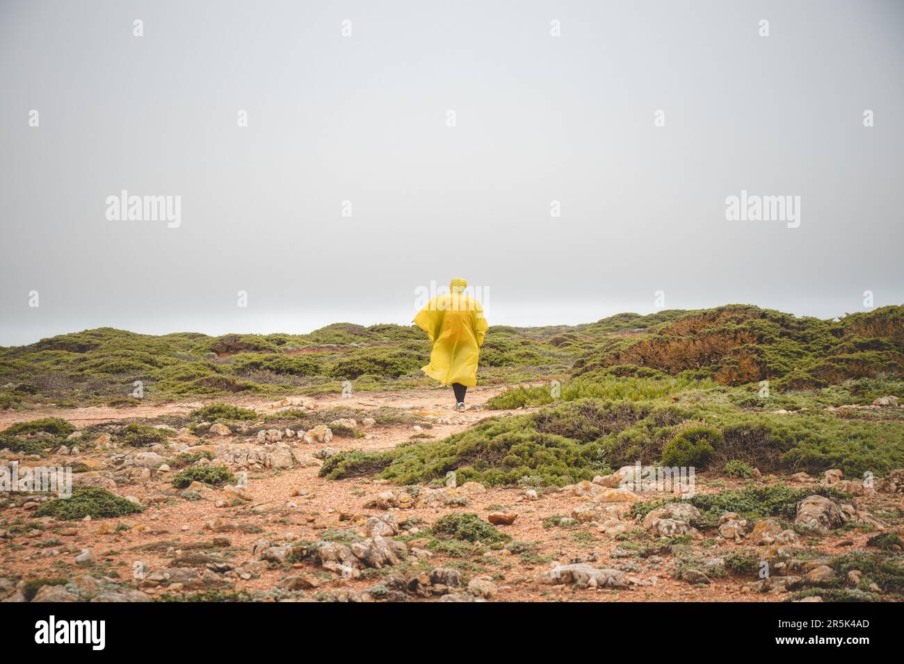 Wandering in heavy rain and wearing a raincoat along the Fisherman ...
