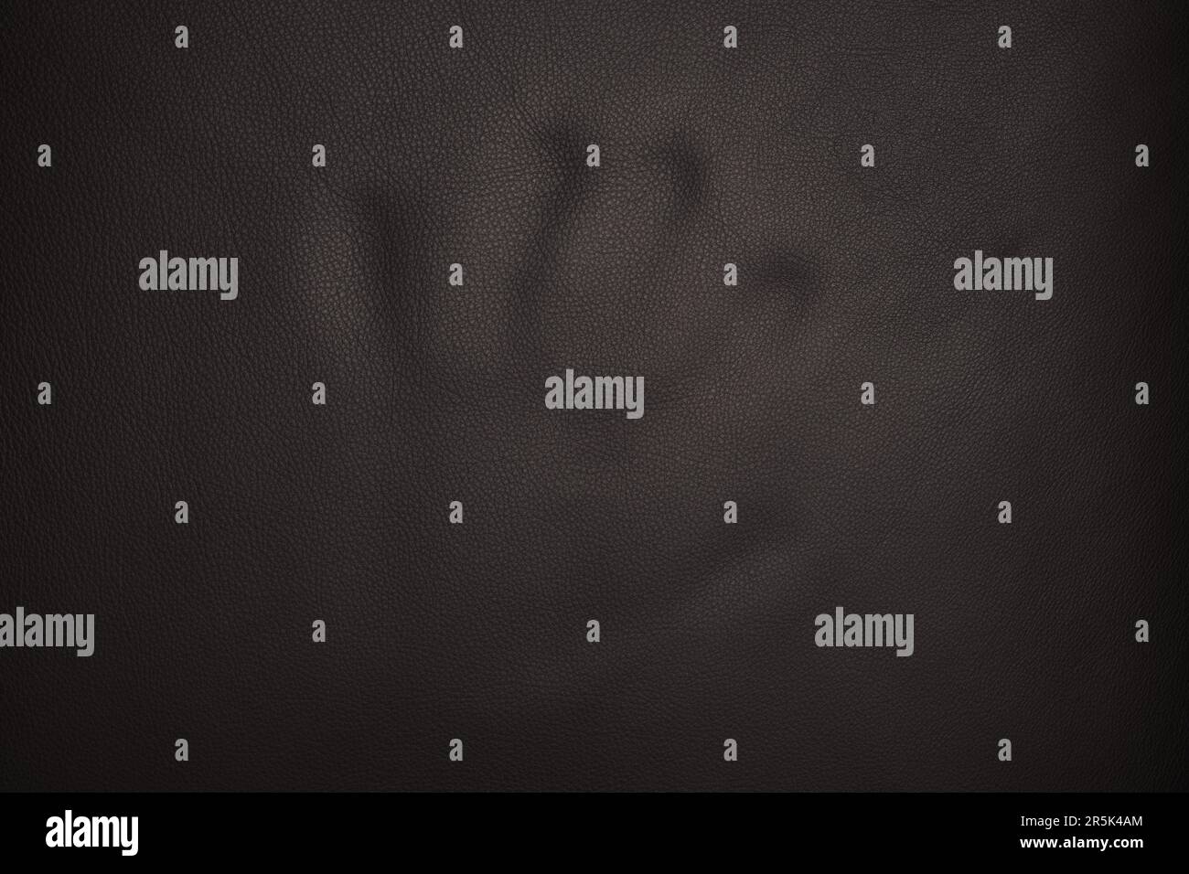 Full grain black leather background with hand mark, backdrop photo ...