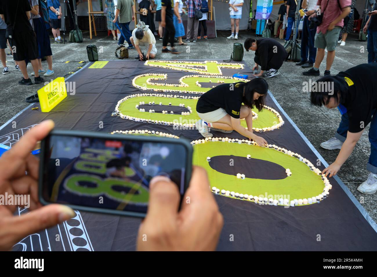 Taipei, Taipei, Taiwan. 4th June, 2023. A man records videos of workers ...