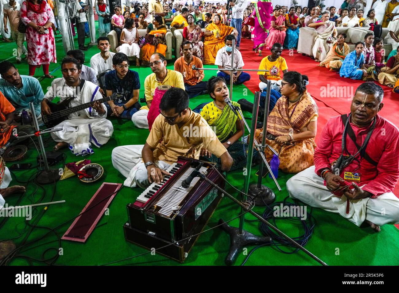 Hindu devotees sing devotional songs before idols of Hindu deities of ...