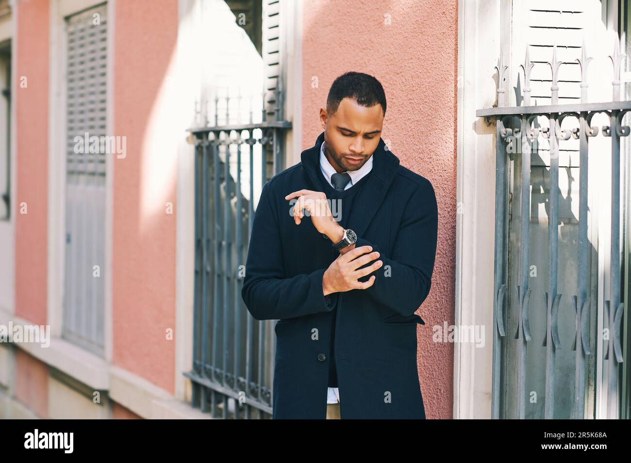 Outdoor portrait of handsome African American male model, wearing blue ...