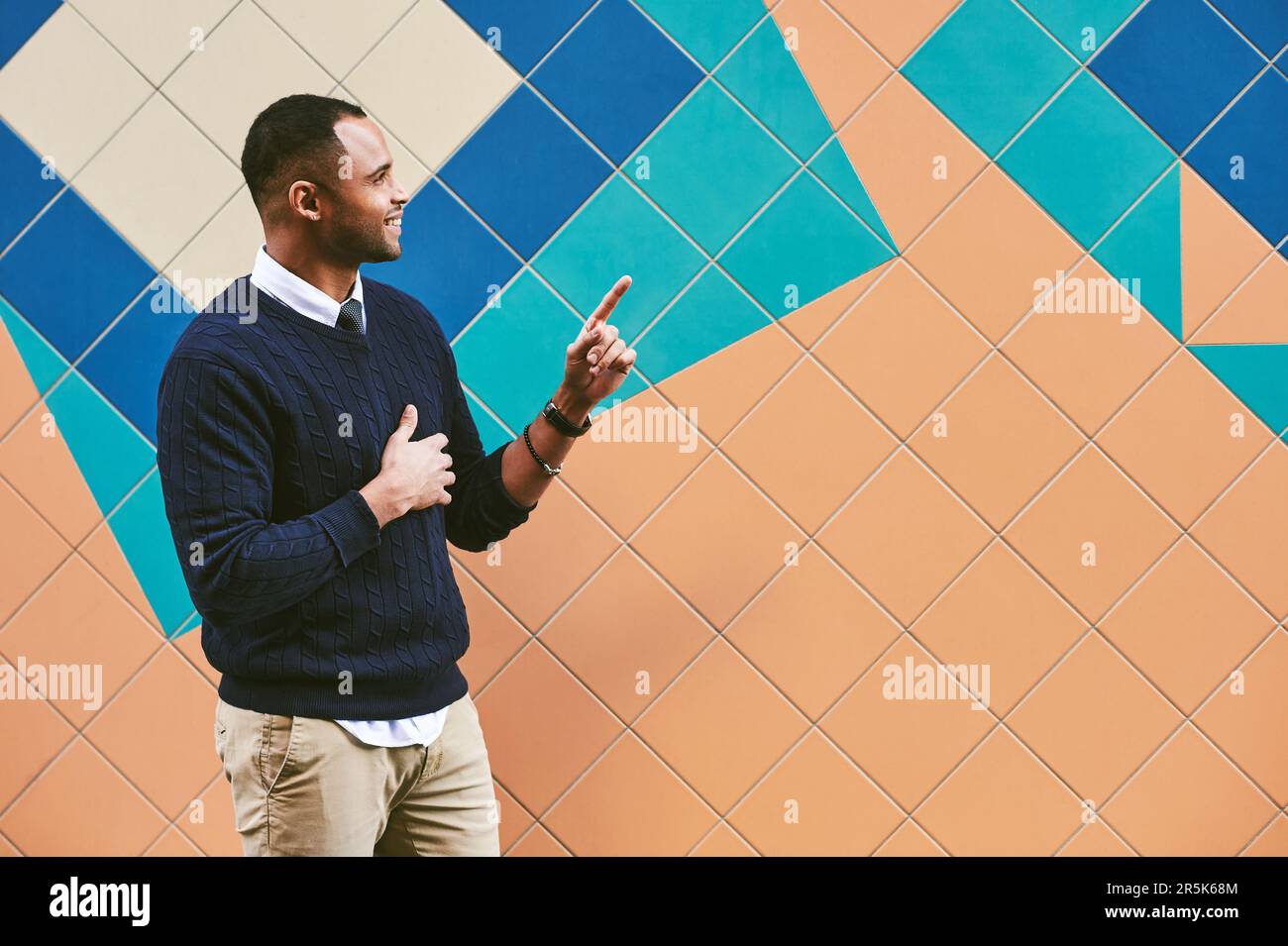 Businessman pointing on street hi-res stock photography and images - Alamy