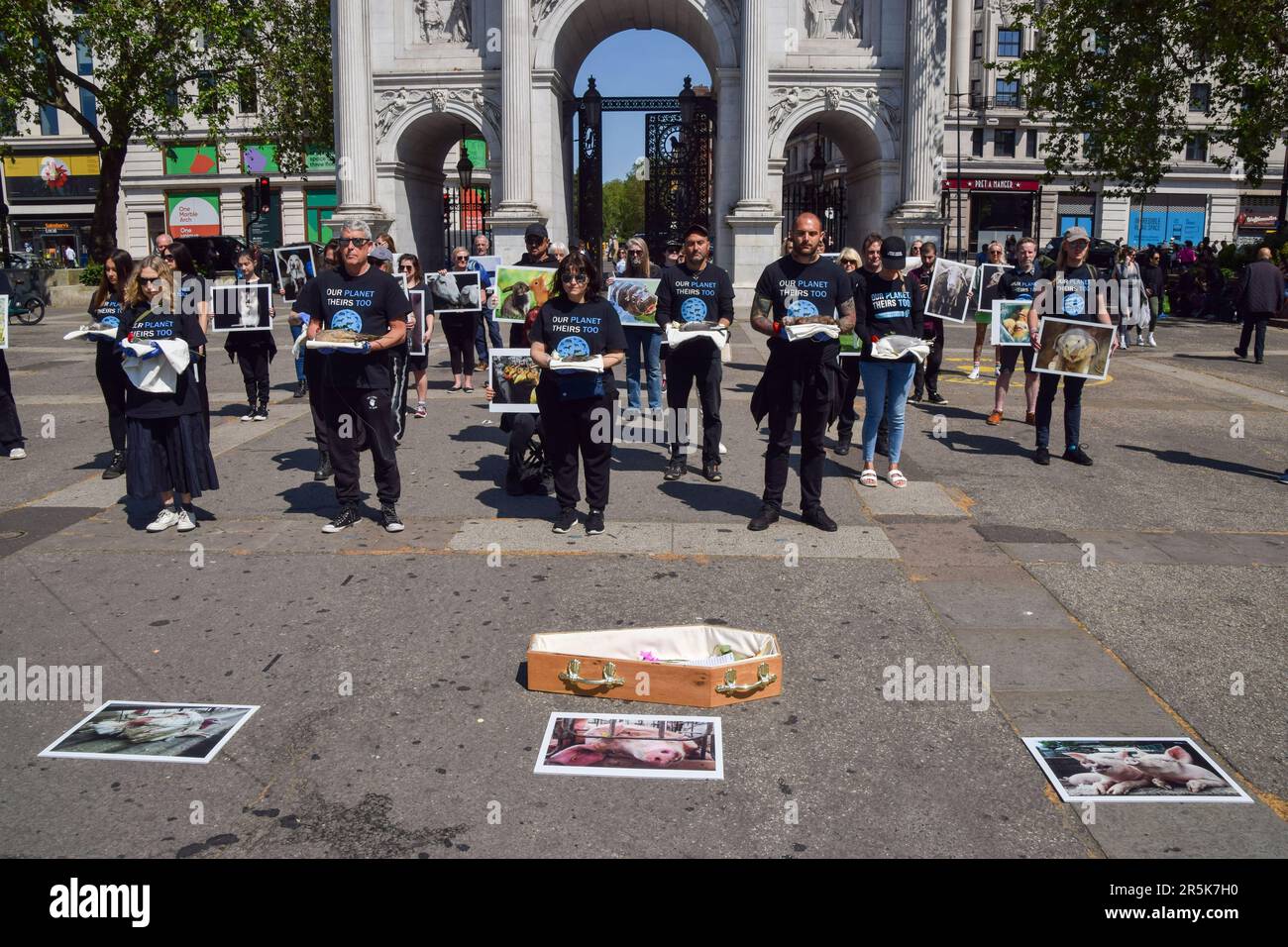 London, England, UK. 4th June, 2023. Activists holding pictures of animals and some holding real ...
