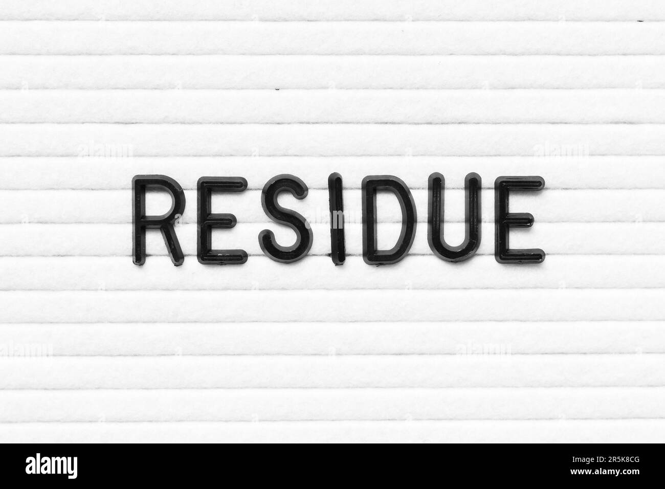 Black letter in word residue on white felt board background Stock Photo ...