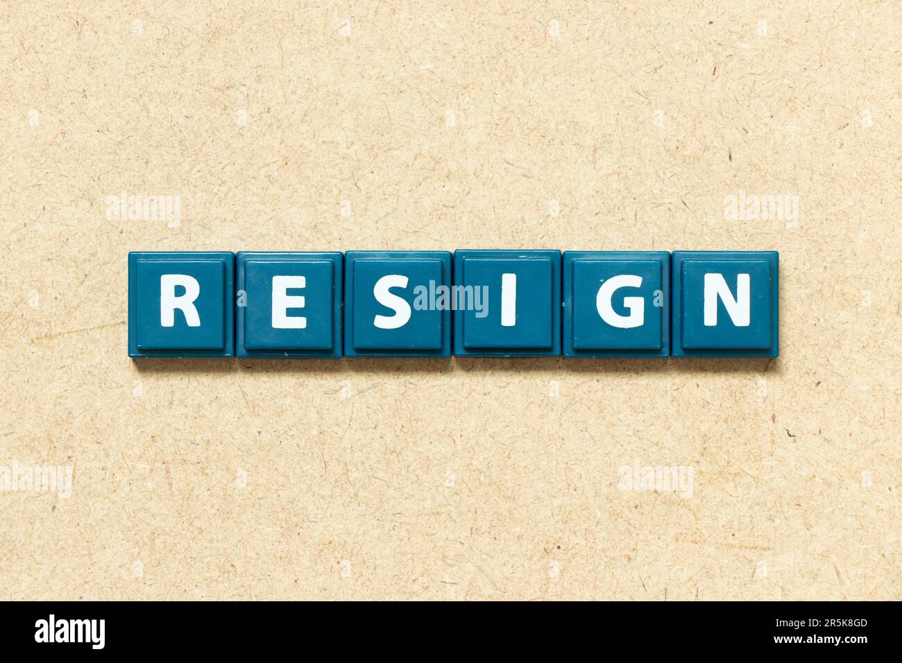Tile alphabet letter in word resign on wood background Stock Photo - Alamy