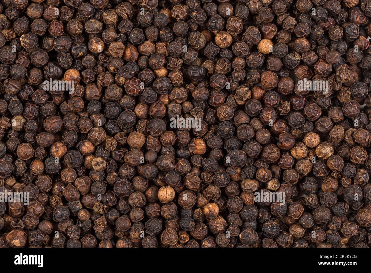 Black pepper zoomed in on and close up texture Stock Photo - Alamy