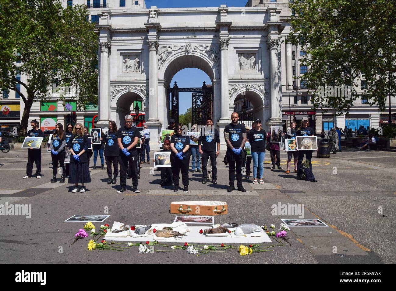 London, UK. 4th June 2023. Activists stand next to bodies of dead ...