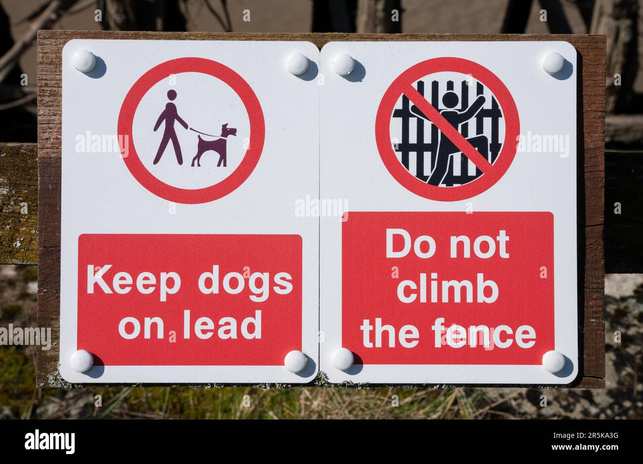 Do Not Climb The Fence and Keep Dogs on Lead signs in rural setting ...