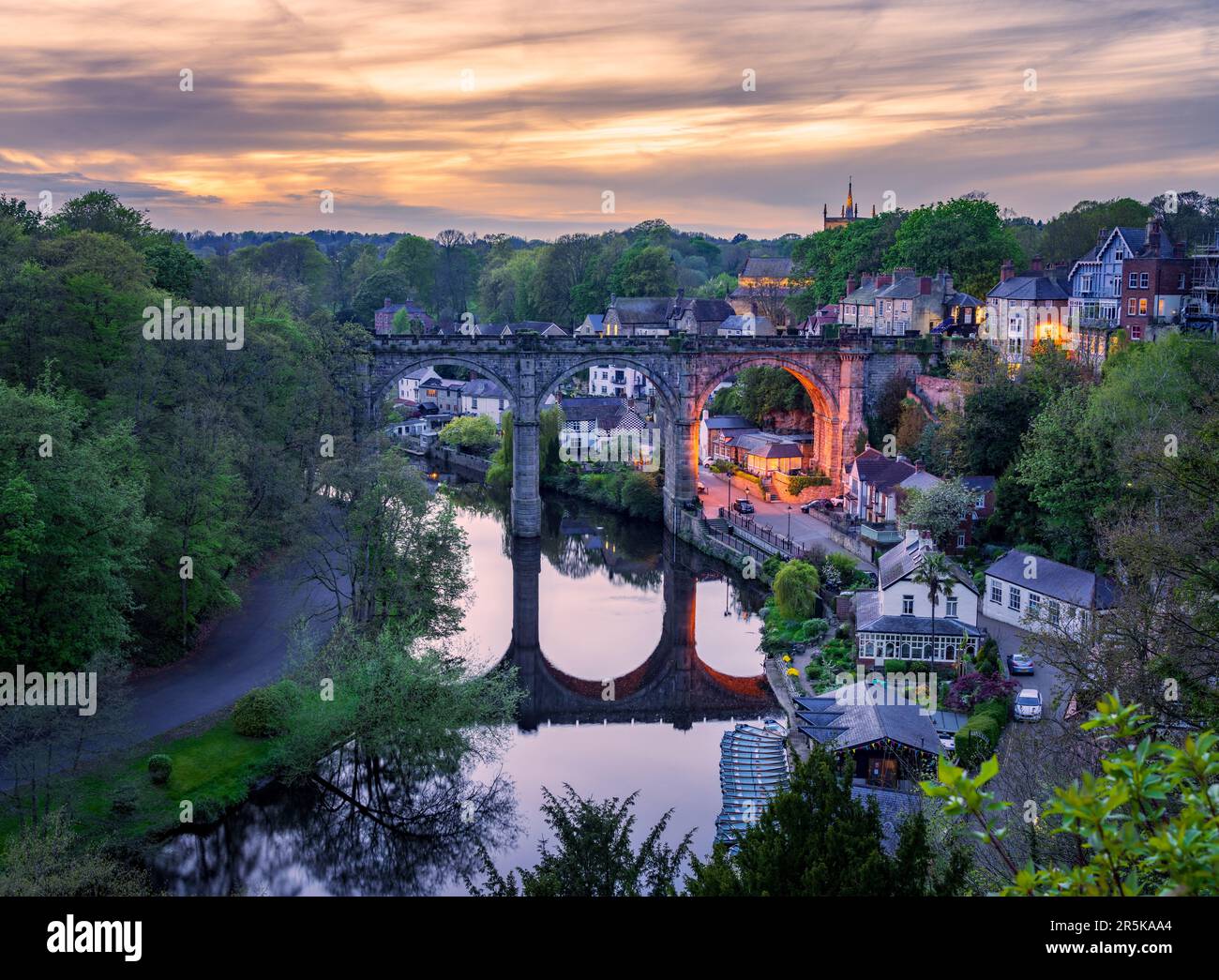 Stone viaduct over River Nidd at Knaresborough with rowing boats by ...