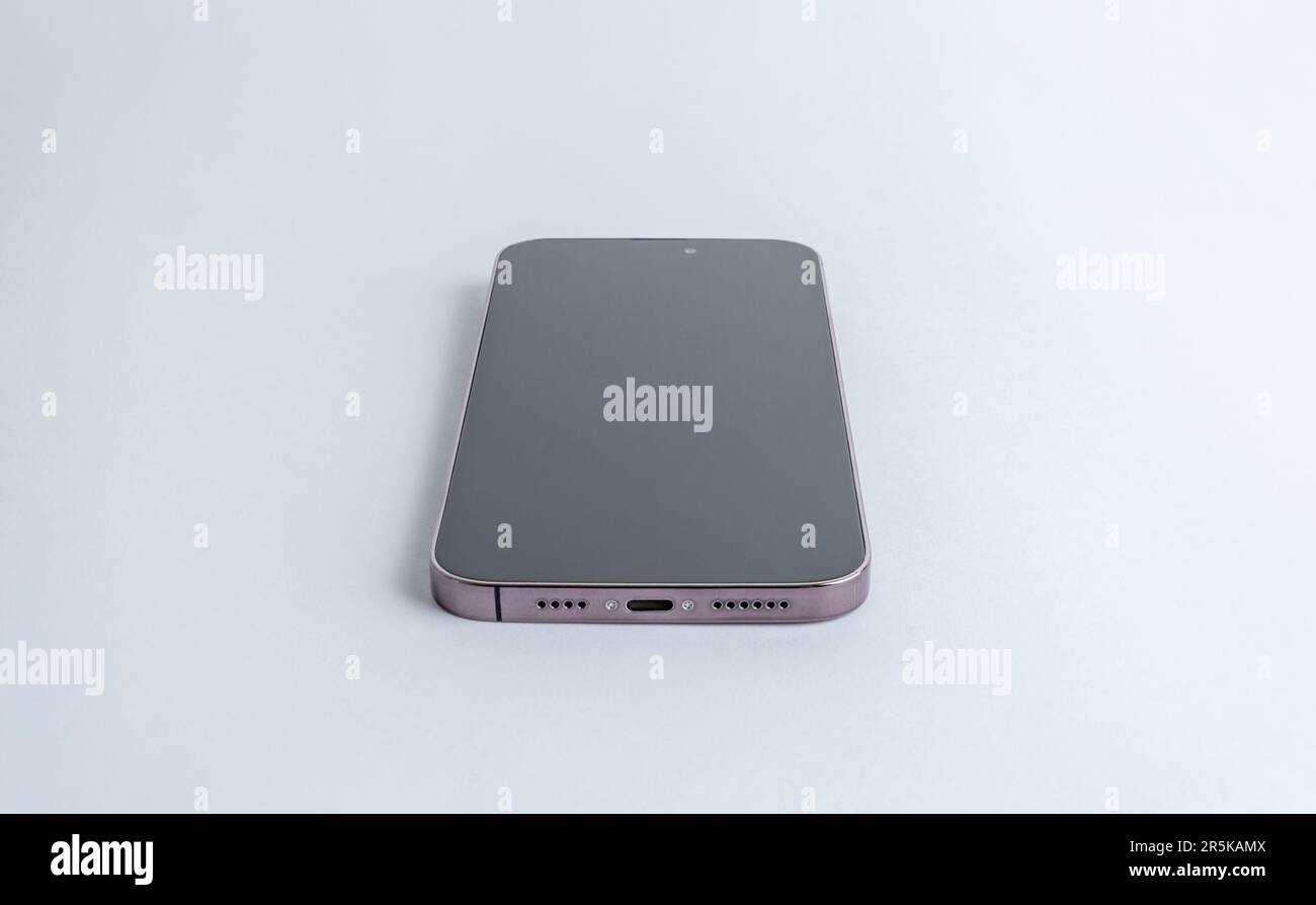 View of the phone on the table from the bottom. Charging port and the ...