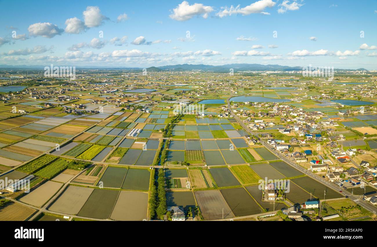 Aerial view of flooded and dry fields by reservoirs in small rural town ...