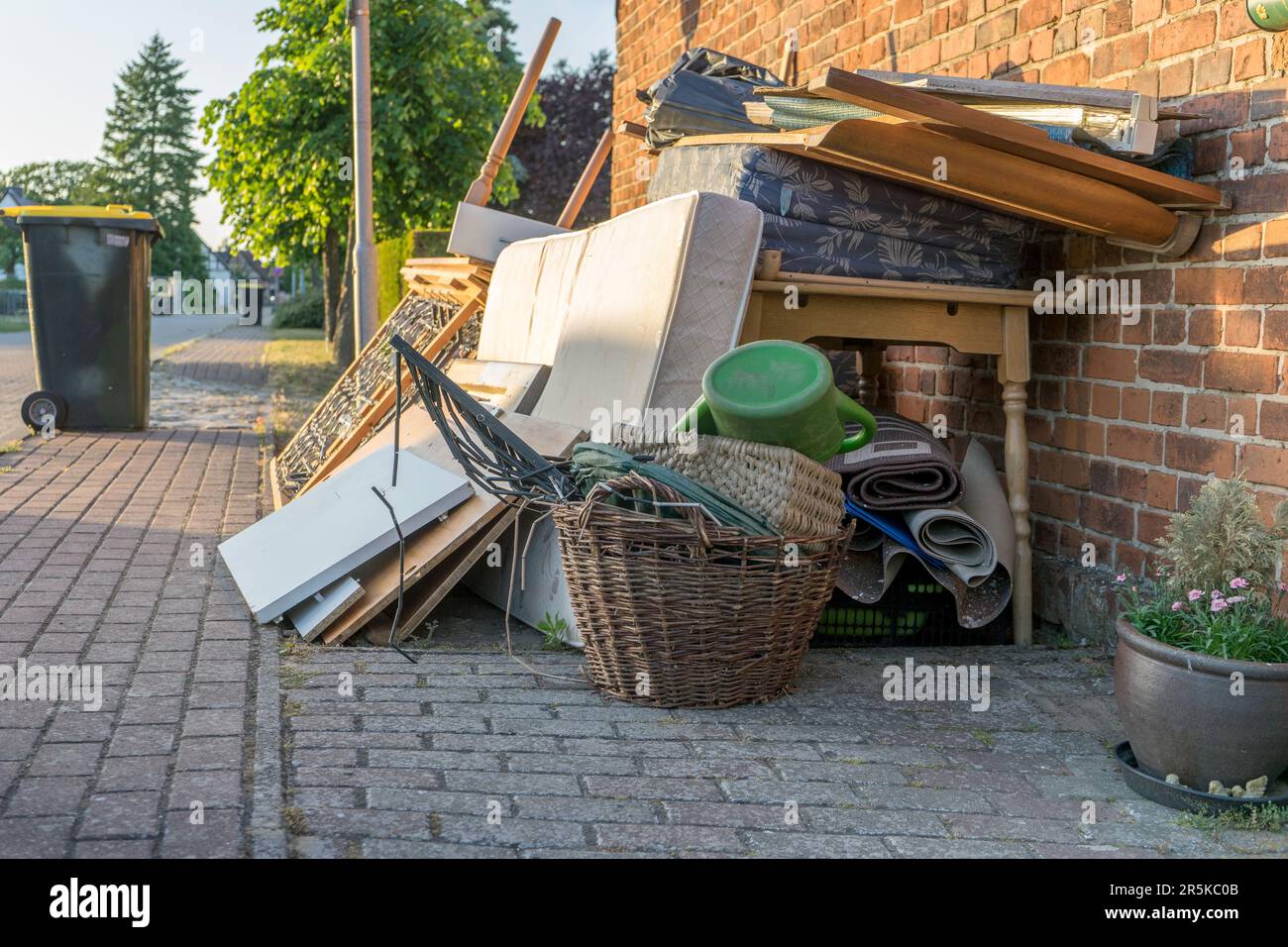 Bulky garbage heap with mattresses, bed frame, table and cupboards at ...