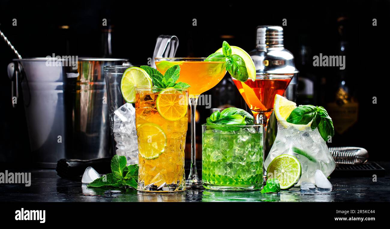 Cocktail party, alcohol drinks with gin, whiskey, vermouth and liquor ...
