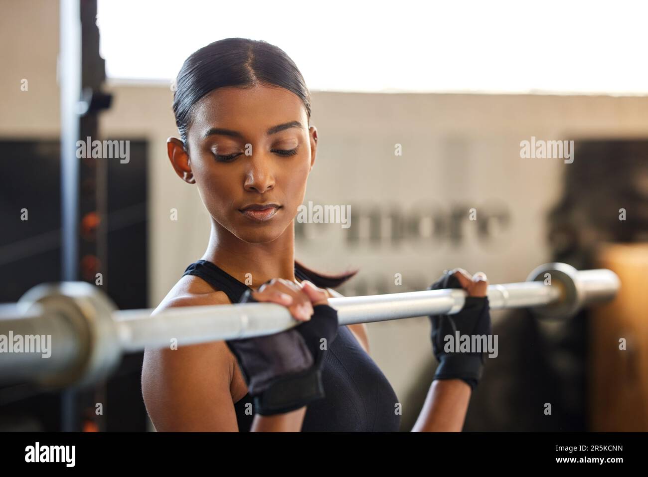 Fitness, Indian woman or bodybuilder with a barbell in training ...