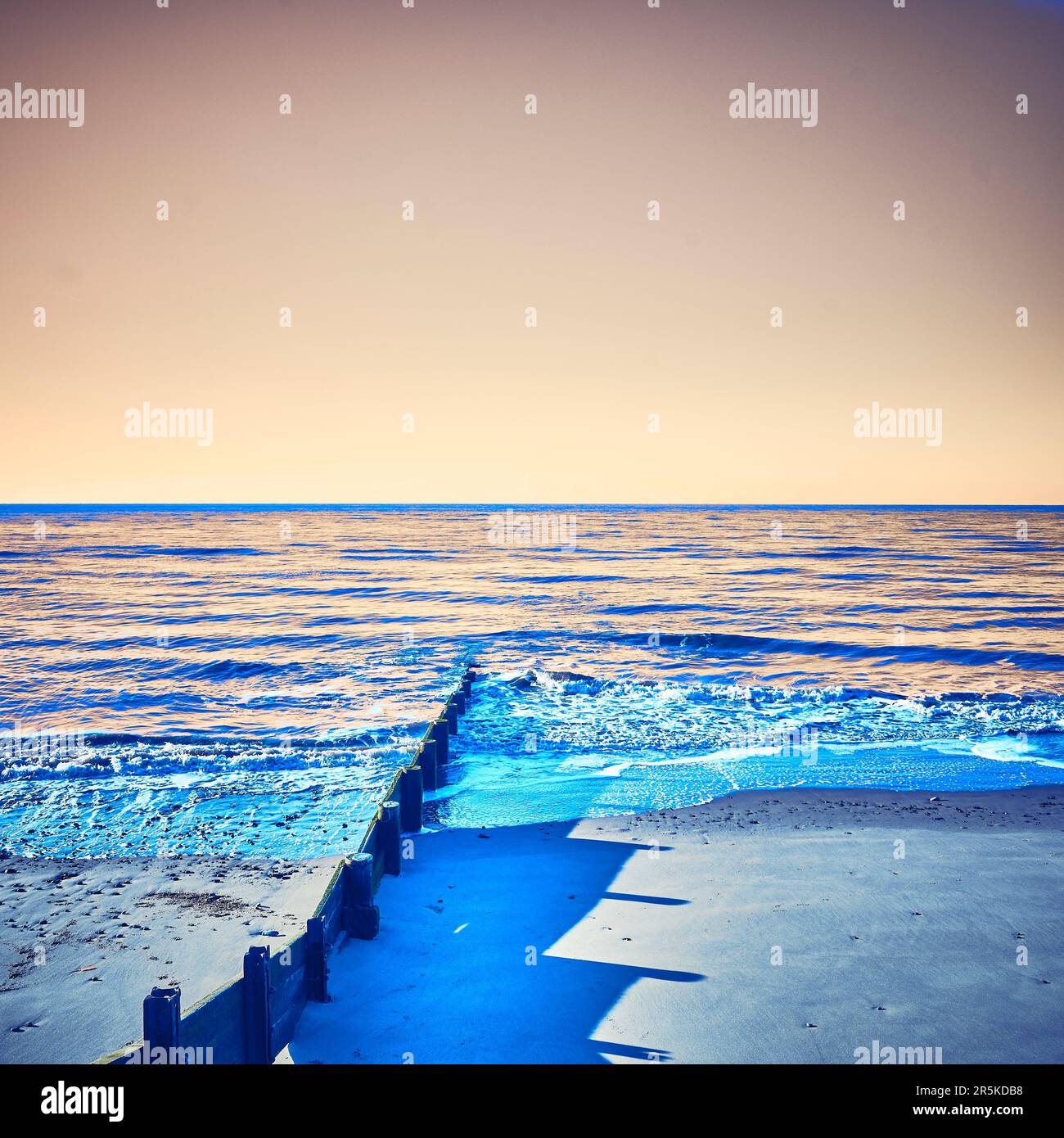 Blue and orange coastline Stock Photo - Alamy