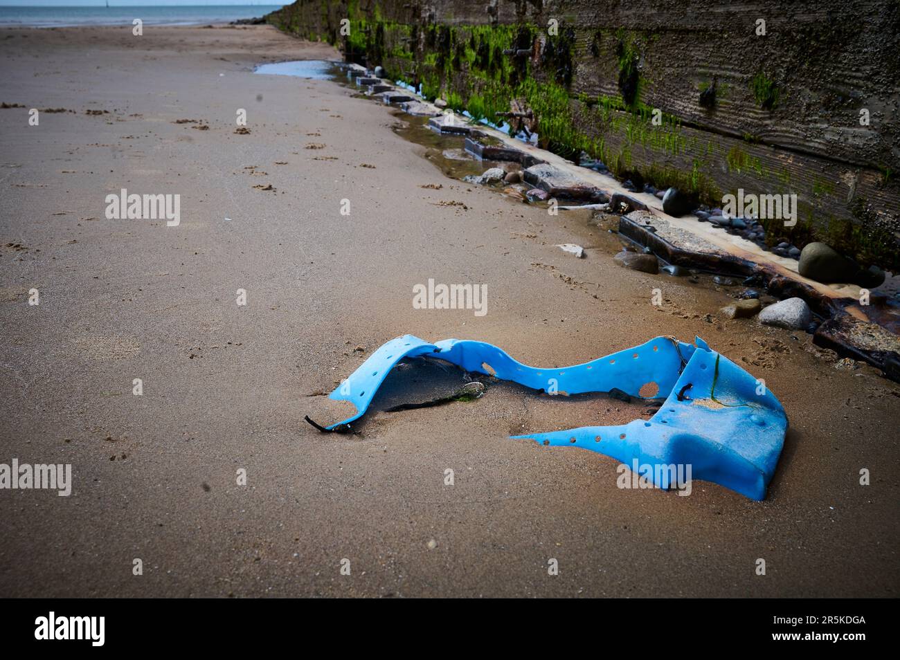 Blue plastic pollution on a beach Stock Photo - Alamy