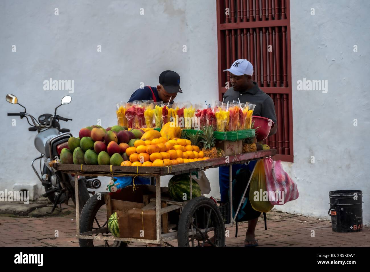 Cartagena, Columbia — Jan 11, 2023. A pair of merchants stands by thier ...
