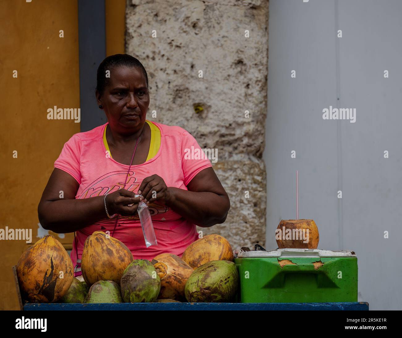 Cartagena, Columbia — Jan 11, 2023. A woman street merchant stands ...