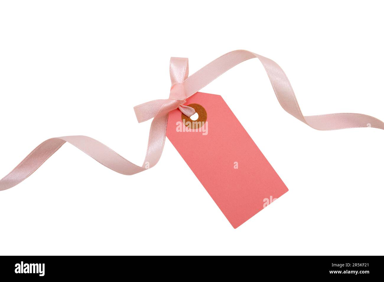 Pastel pink color empty gift card and curly ribbon. Blank price tag ...