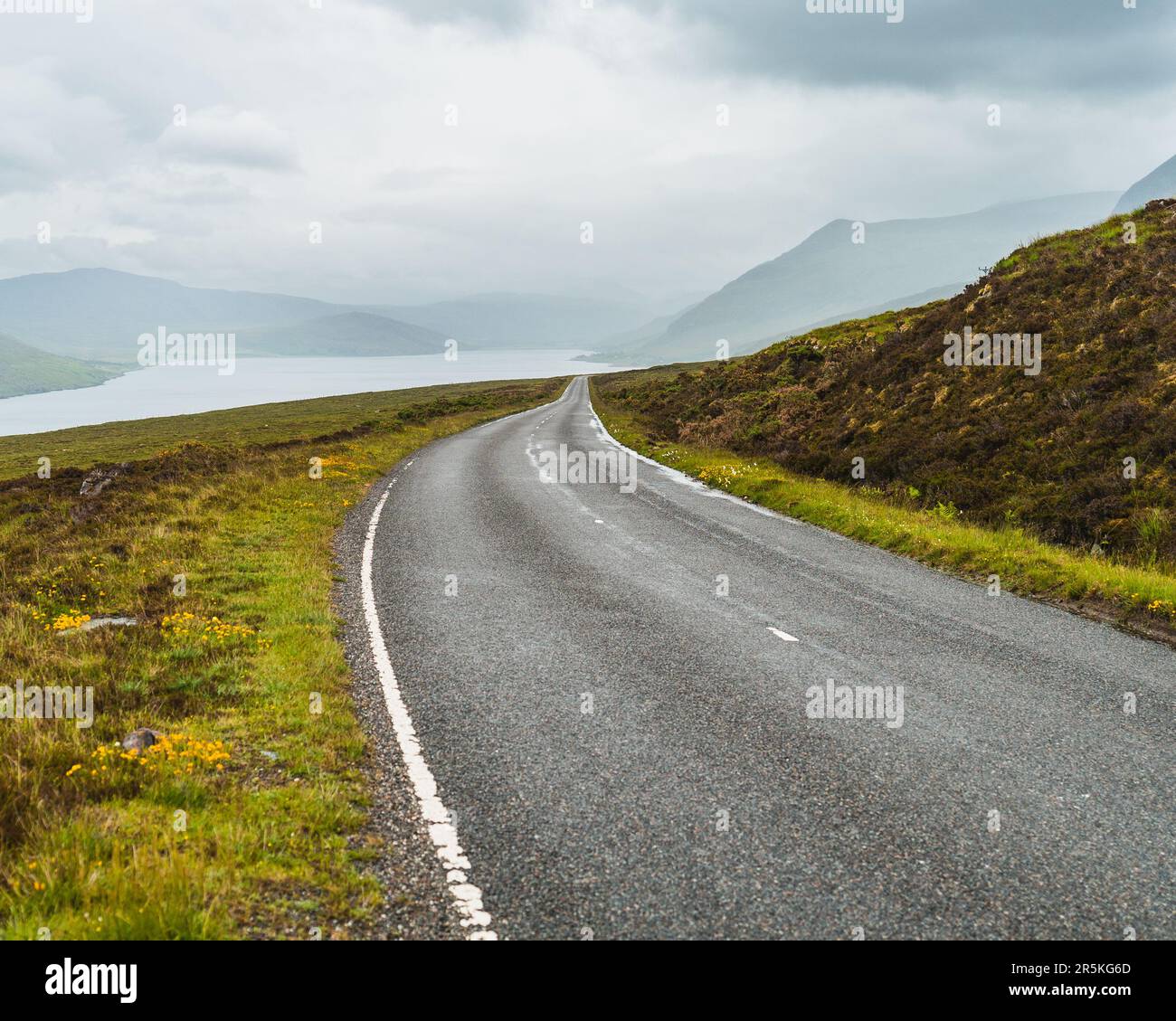 A panoramic vista unfolds, revealing the majestic mountain peaks of the ...