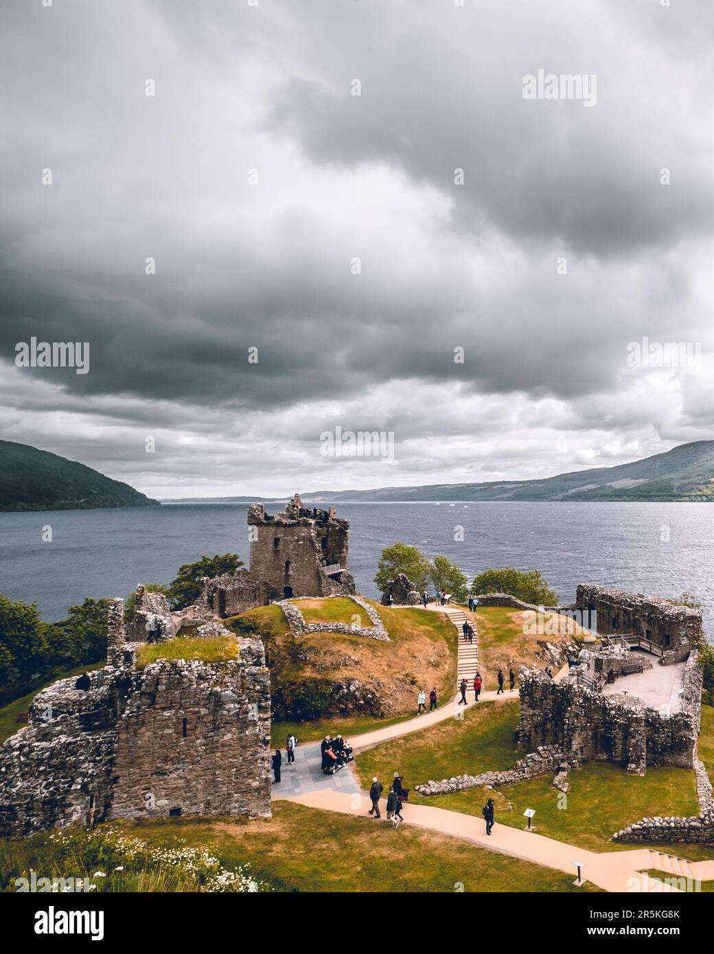Nestled on the shores of Loch Ness, a castle stands proudly against the ...