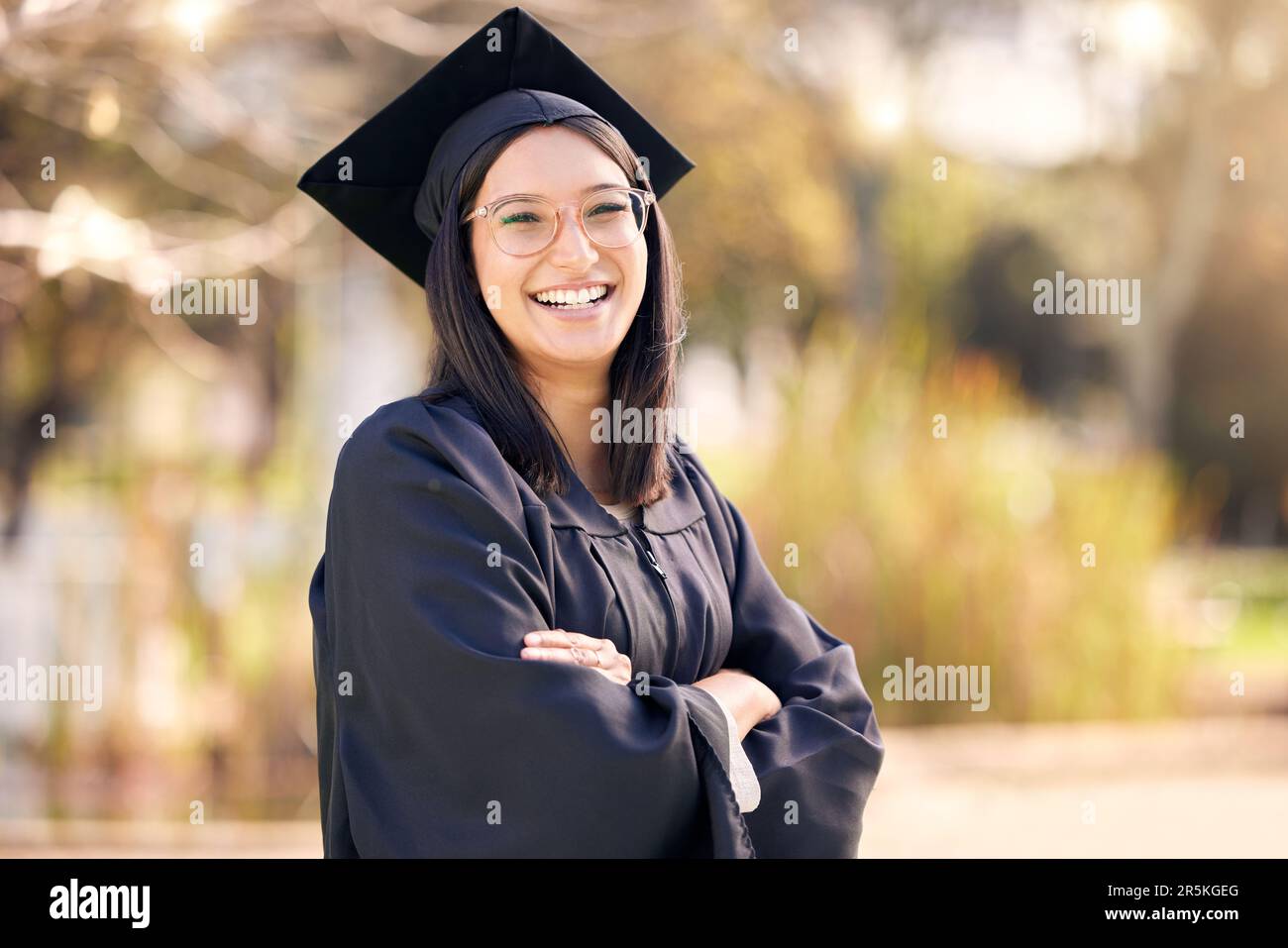 Success, portrait of woman student and on graduation day at her ...