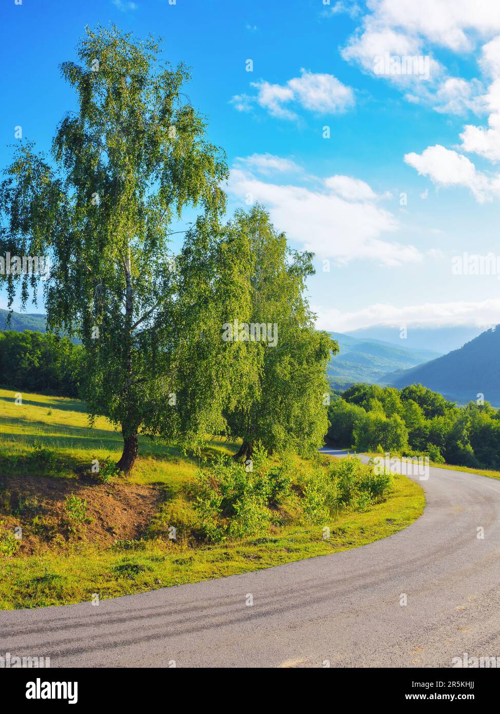 road winds through the foggy countryside, revealing a breathtaking ...