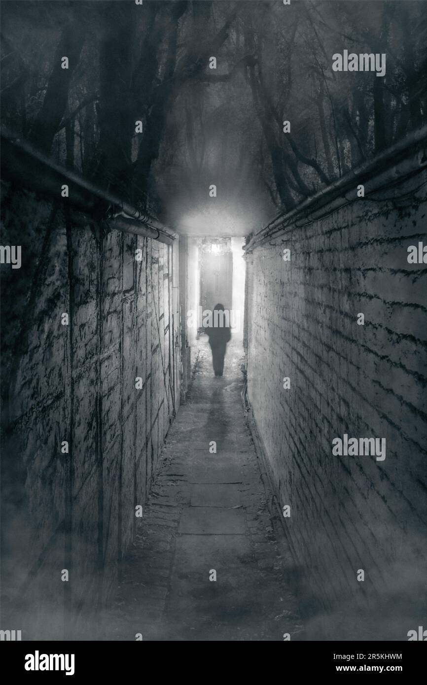 Concept image of a person walking through a spooky walled passage ...