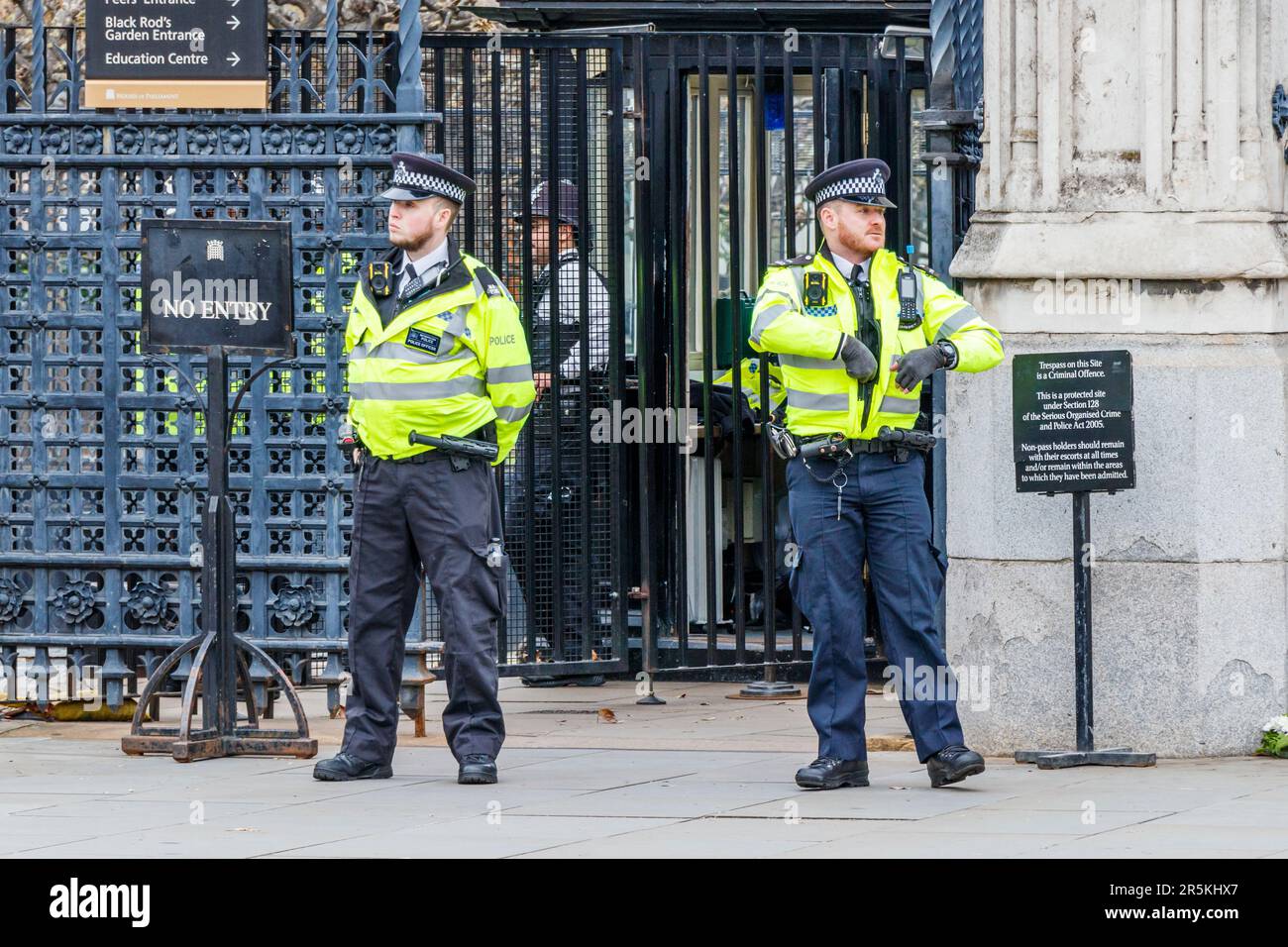 Metropolitan Police officers standing guard at the Carriage Gates of ...