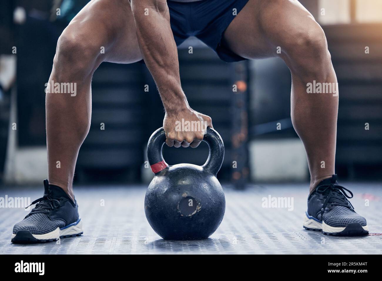 Fitness, floor and kettlebell with a bodybuilder man in the gym for a ...