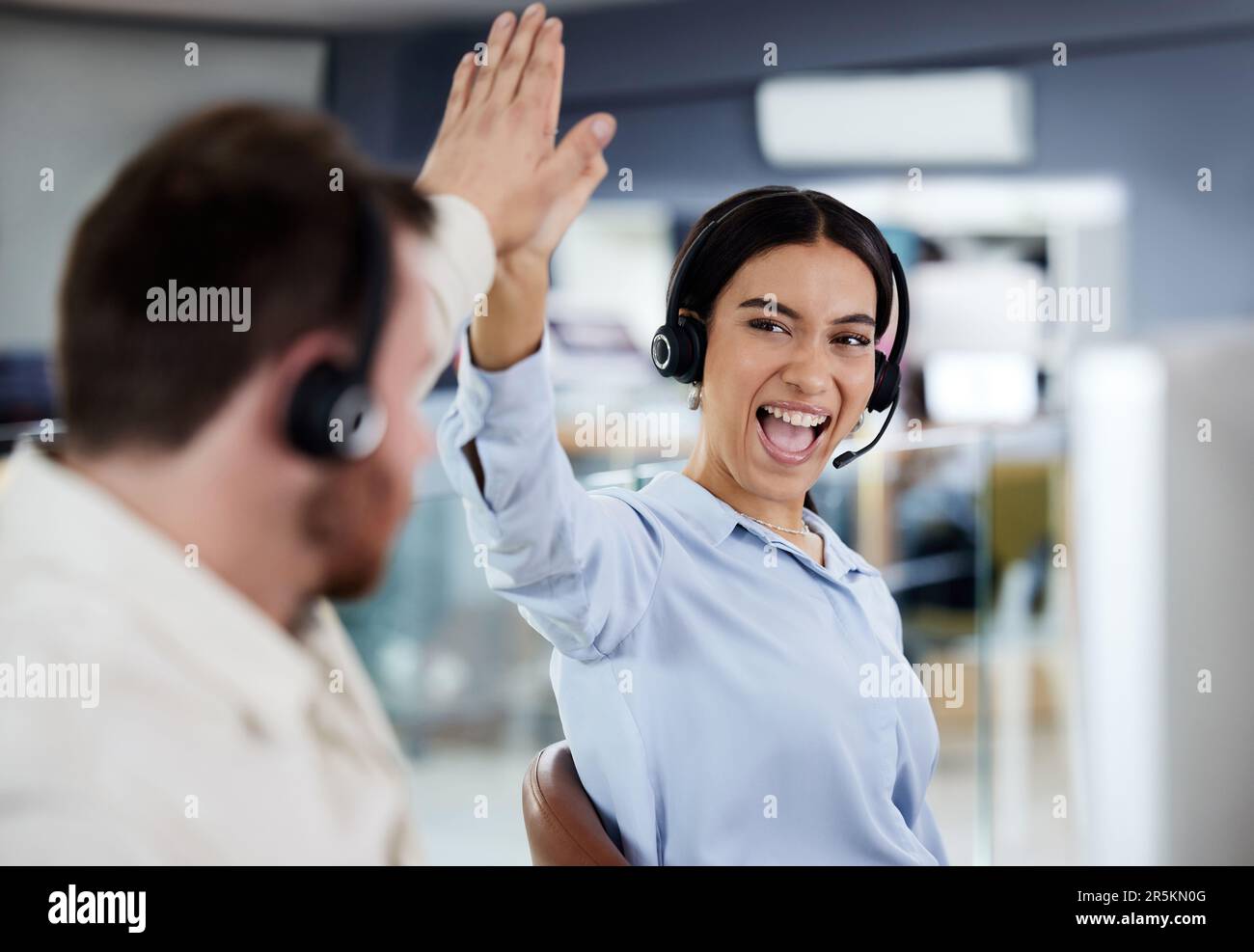 Support, colleagues with headset and at their desk of a modern ...