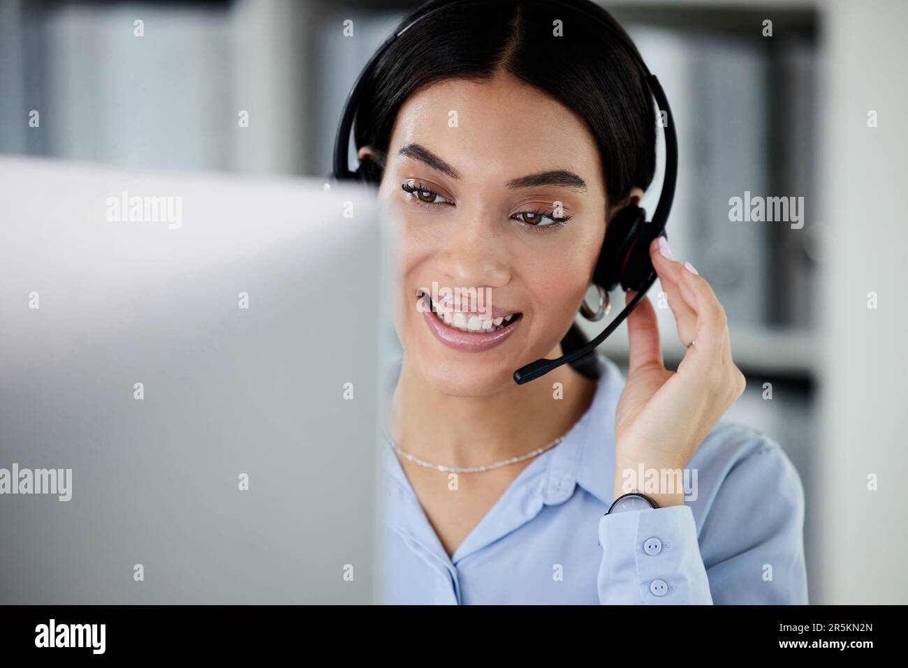 Customer service, woman with a headset and computer at her desk of her ...