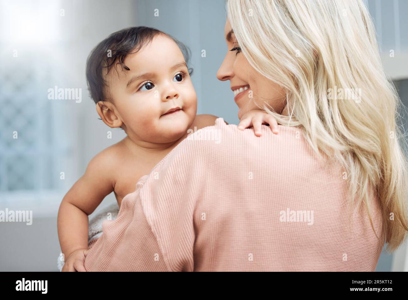 Bonding, love and mother holding her baby in the nursery room of their ...