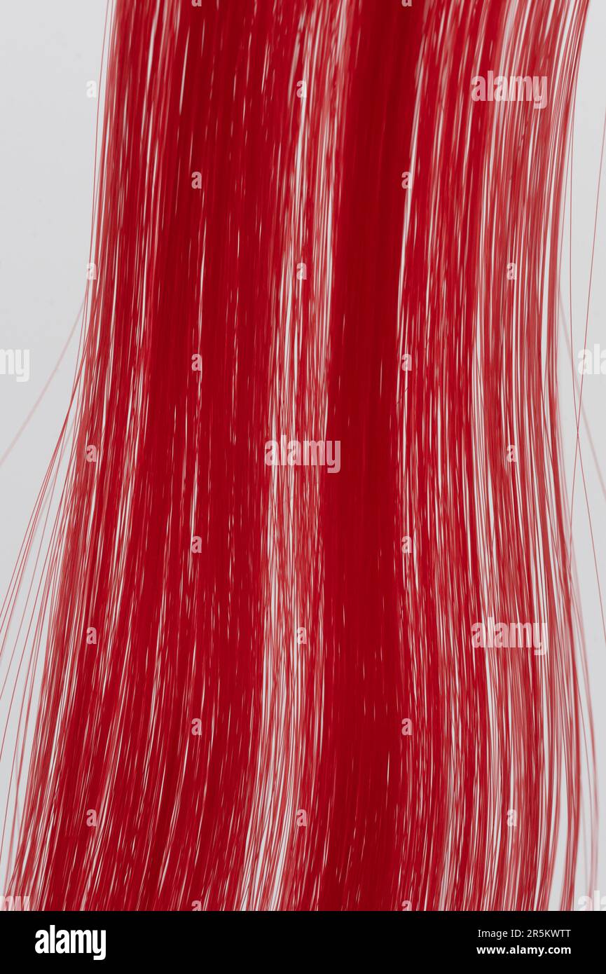 Smooth straight orange color hair isolated macro view Stock Photo - Alamy