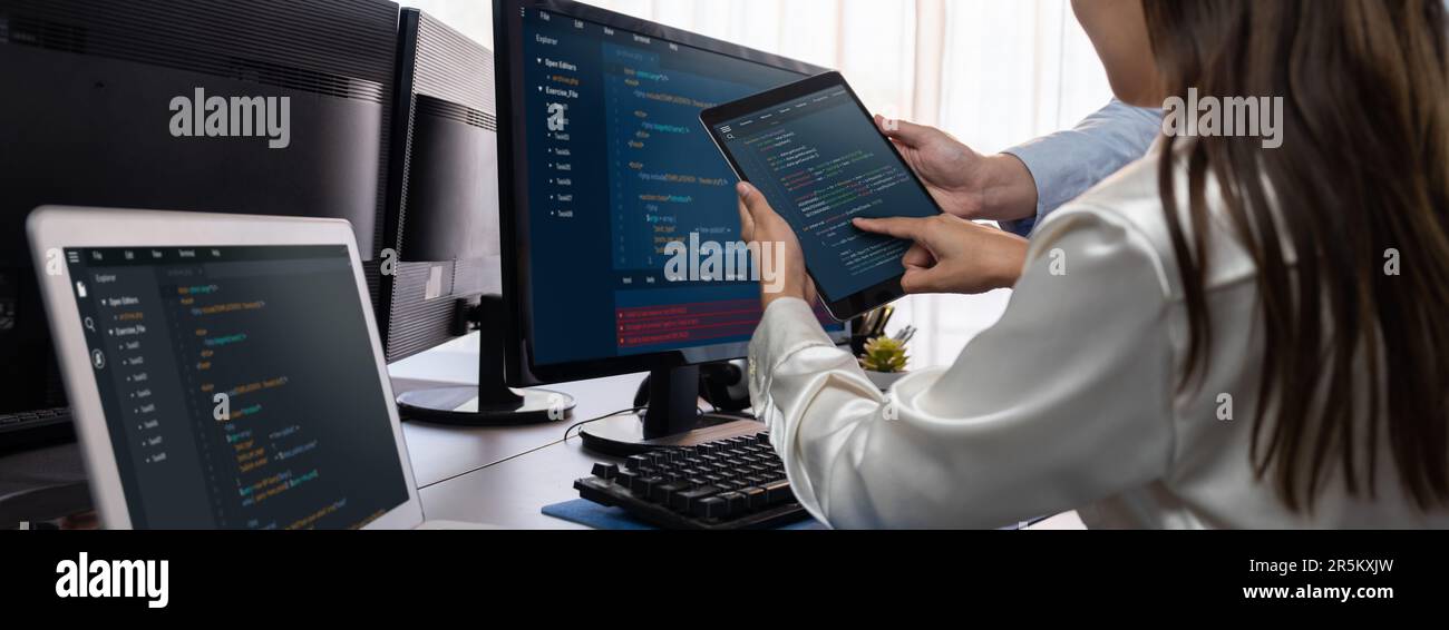 Software Development Team Working Together In Office Coding Script Display On Computer Monitor