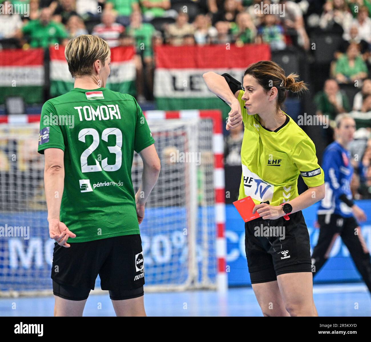 Zsuzsanna Tomori of FTC walks past the referee holding a red card ...