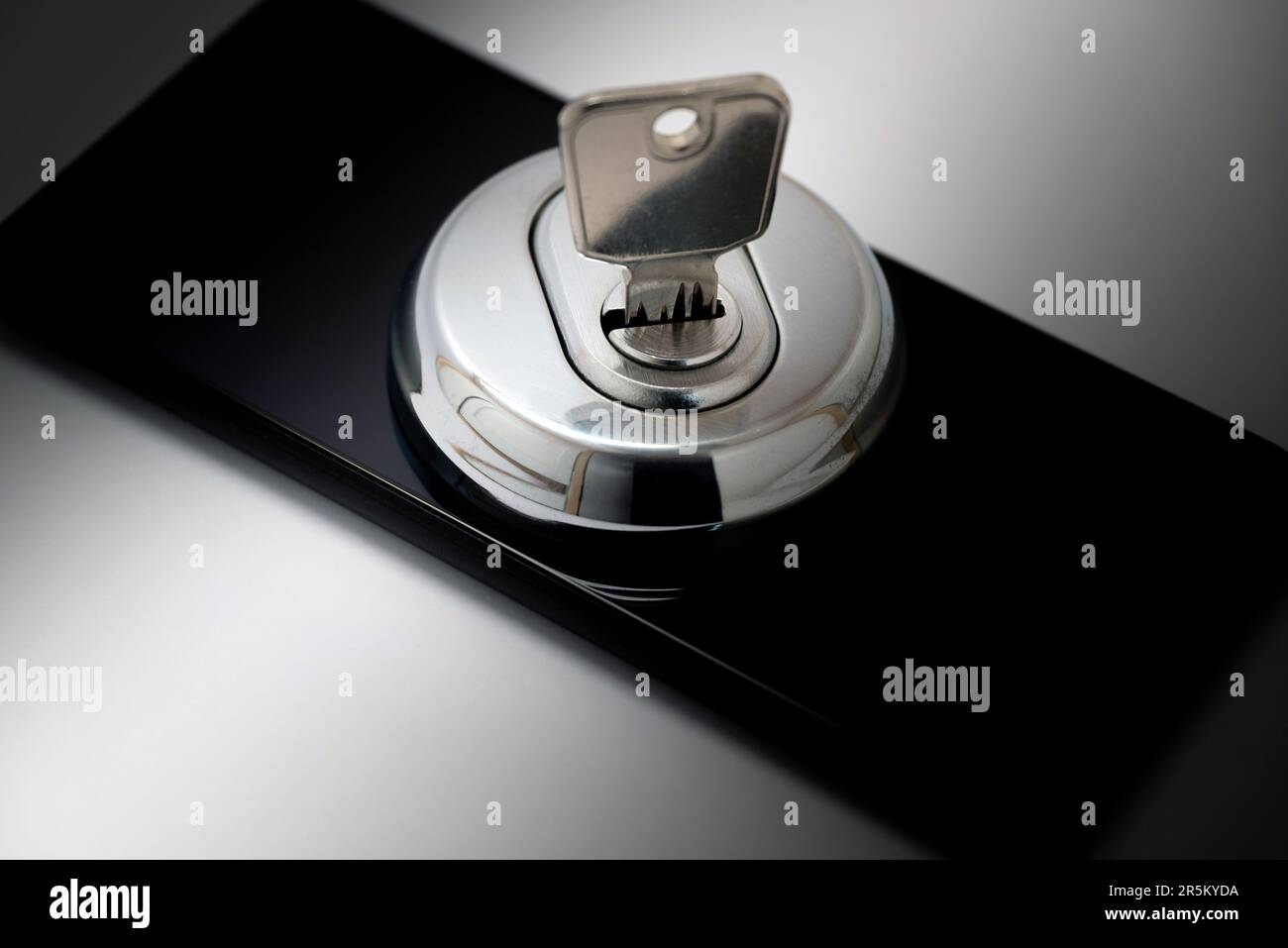 Smartphone locked and blocked by a real key Stock Photo - Alamy