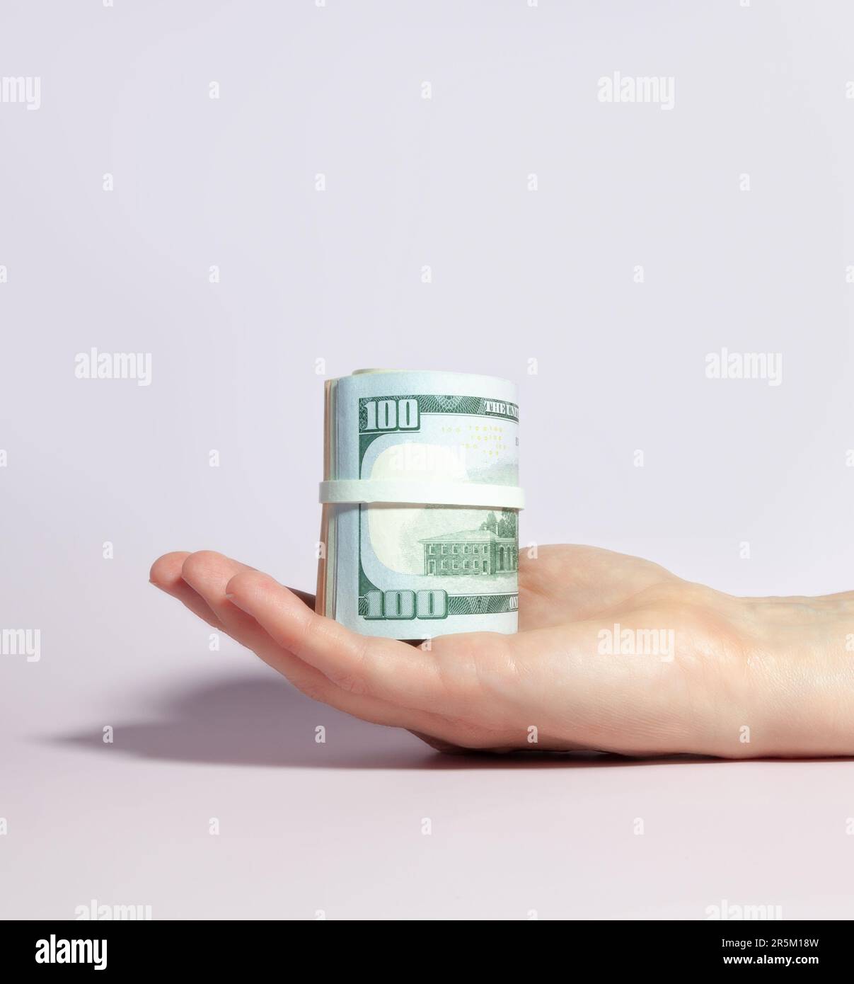 Rolled bundle us 100 hi-res stock photography and images - Alamy