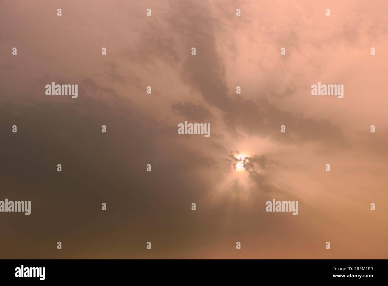 Sky, with diffused sun clouds colourful Stock Photo - Alamy