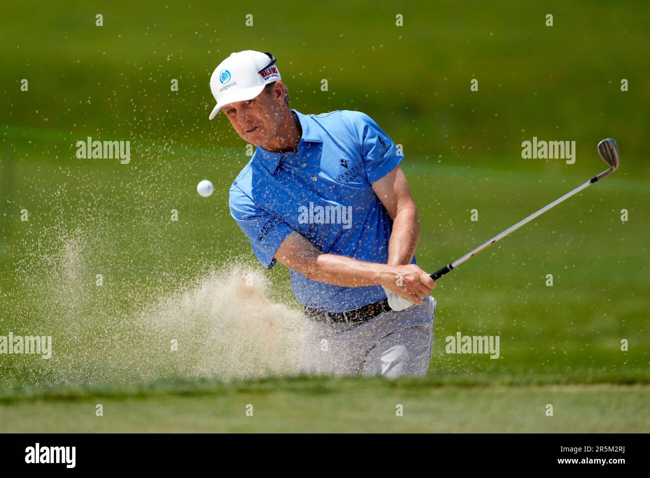 David Toms hits out of a bunker on the fifth green during the final ...