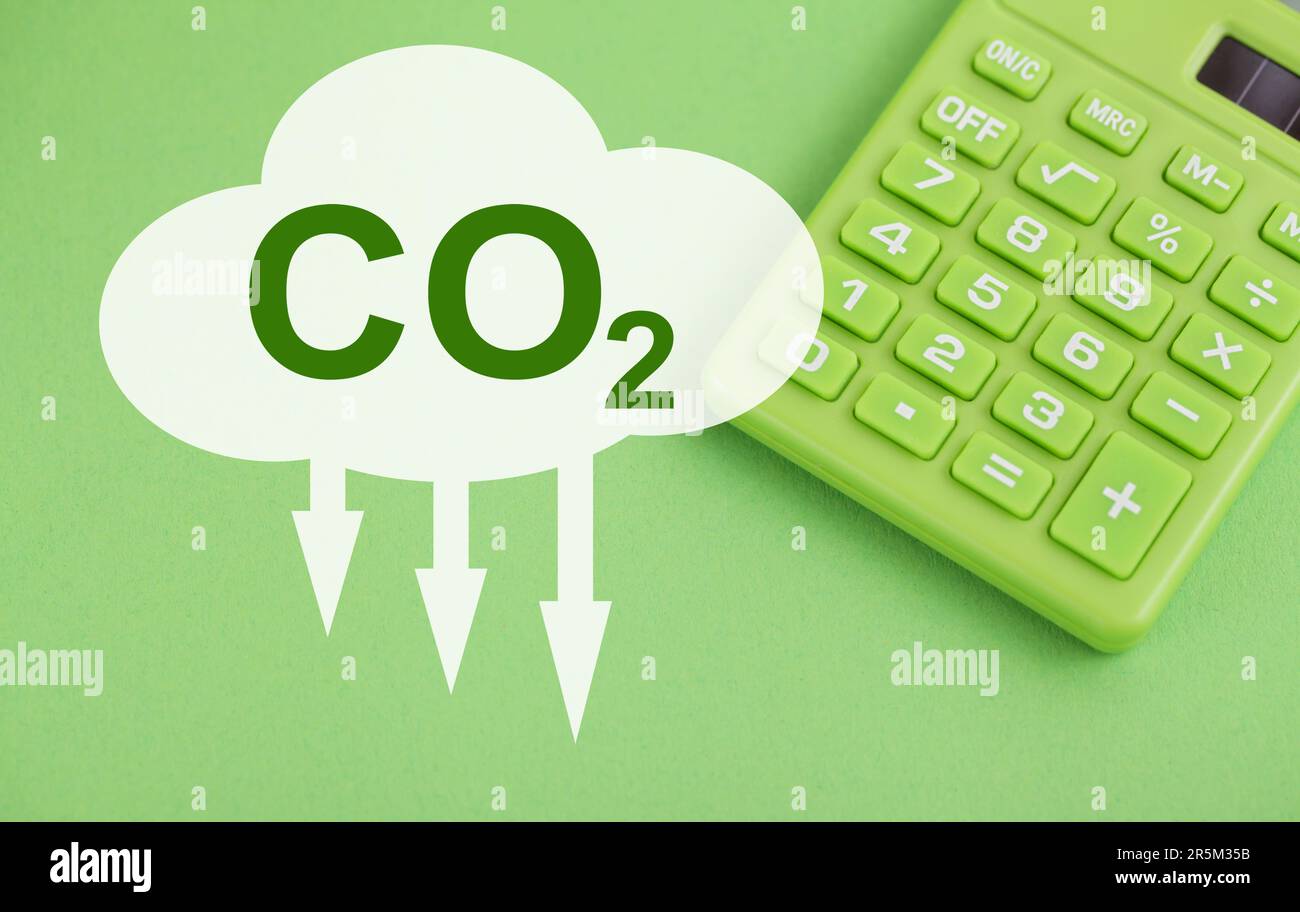 CO2, Green calculator on Green background. Copy space. Environmental ...