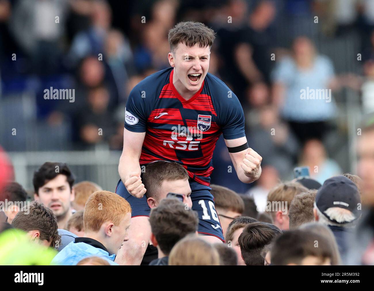 Ross County's George Harmon lifted by celebrating fans following the ...