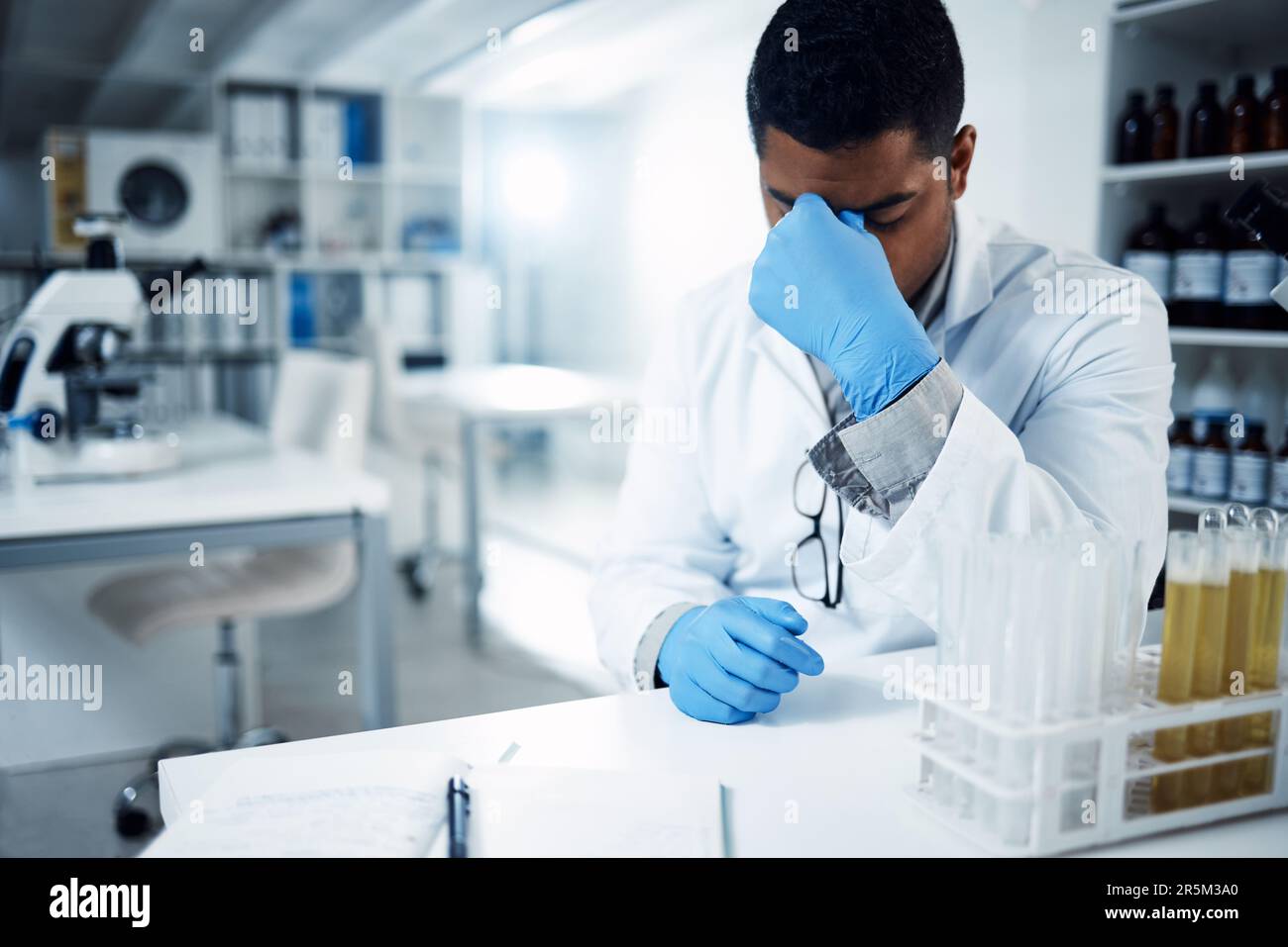 Science, stress and man scientist with headache in a laboratory ...