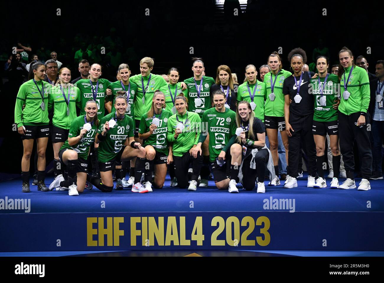Players of second-placed FTC pose for photos during the medal ceremony after the women's ...