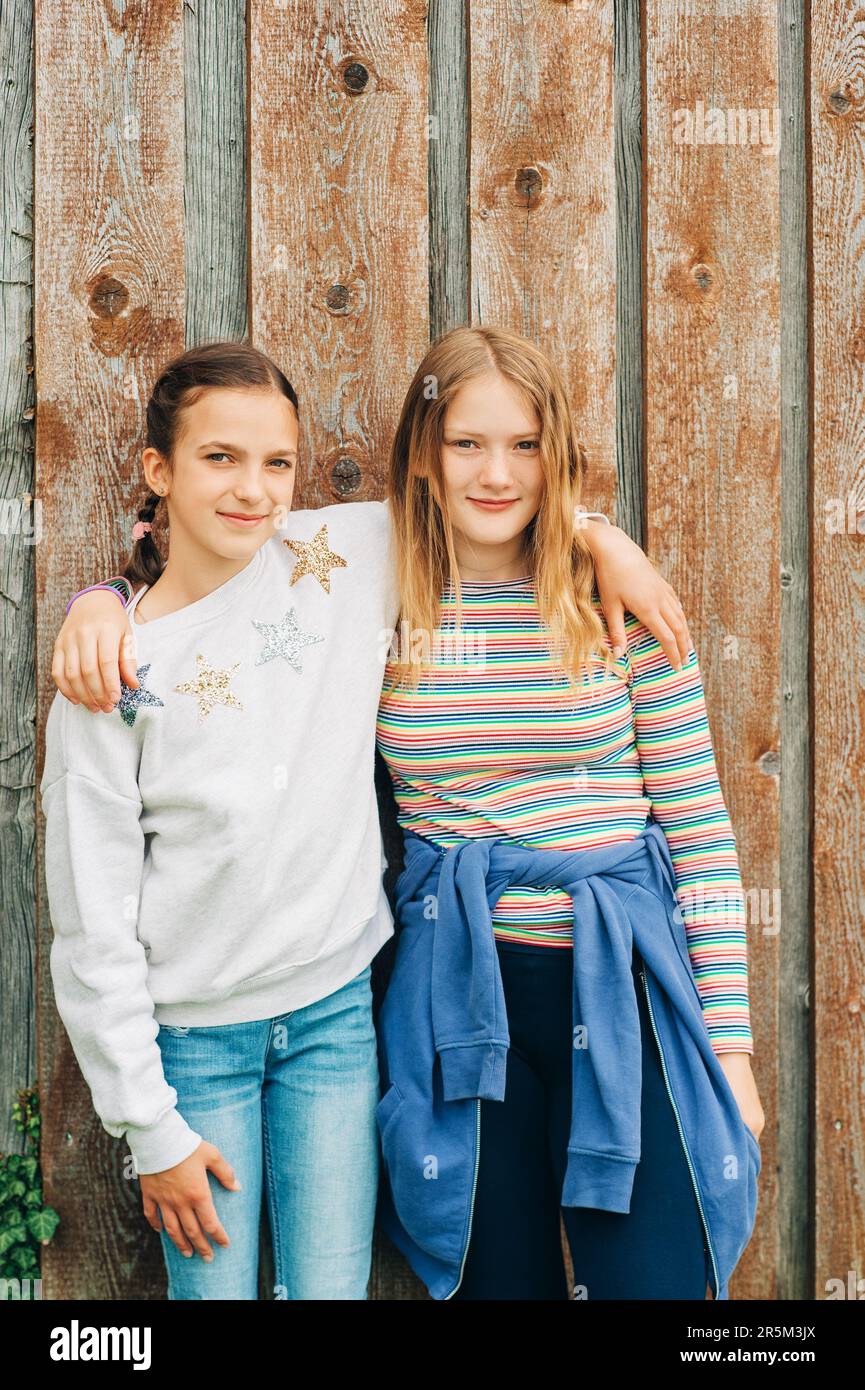 Young preteen 10-12 year old girls posing together outdoors Stock Photo ...