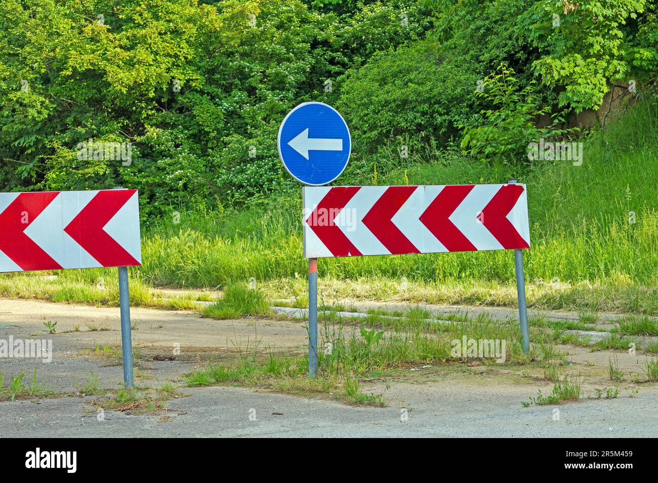 Warning and directional traffic signs on a rural road Stock Photo - Alamy
