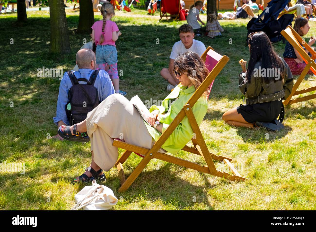 Woman relaxing in lawn chair hi-res stock photography and images - Alamy